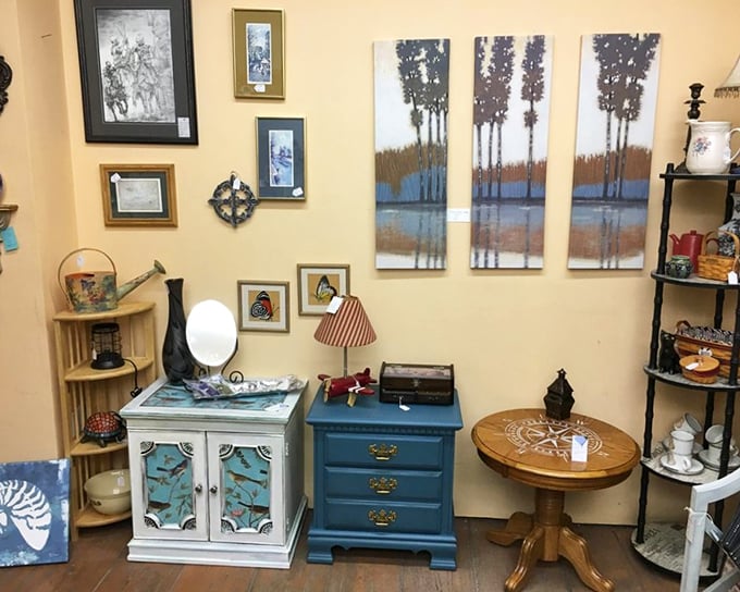 Coastal art meets repurposed furniture in a vignette that could transform any corner of your home into a conversation starter.