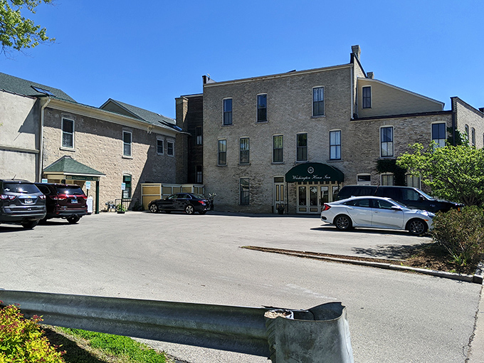 Behind this unassuming cream city brick facade lies the Washington House Inn, where guests sleep in history without sacrificing modern plumbing.