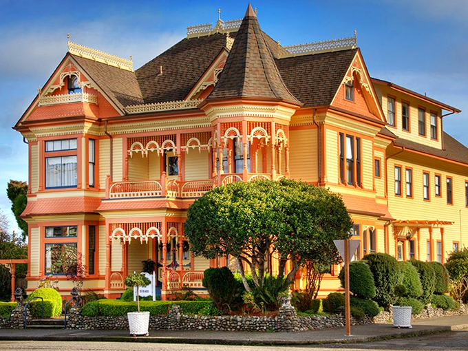 This buttercup-yellow Victorian with its gingerbread trim isn't just a pretty face—it's a masterclass in architectural showing off, 1890s style.
