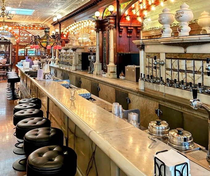 The soda fountain counter &ndash; where magic happens daily as syrups, sodas, and ice cream combine in a choreographed dance of deliciousness.