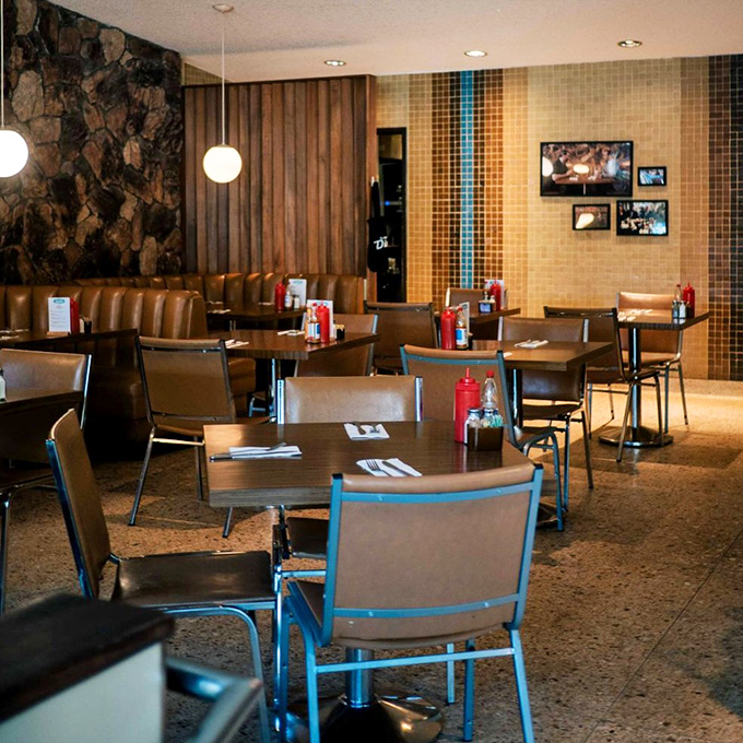 Mid-century meets modern comfort in this thoughtfully designed space. The tile work alone deserves its own architectural award.