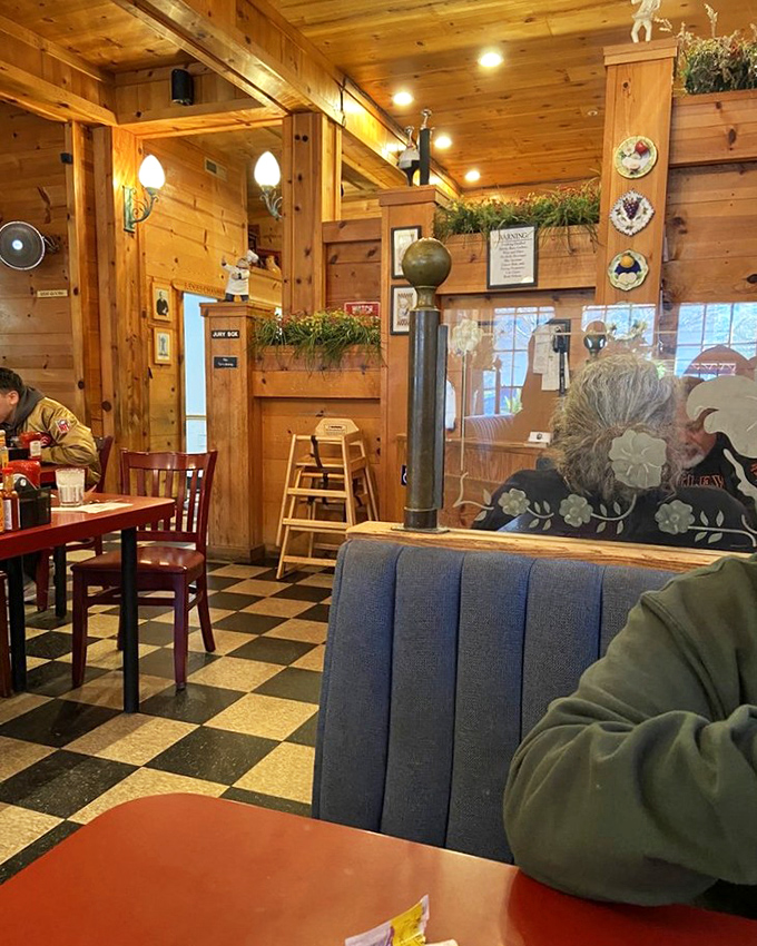 Checkered floors and wood-paneled walls create that classic diner atmosphere where calories don't count and coffee refills are practically mandatory.