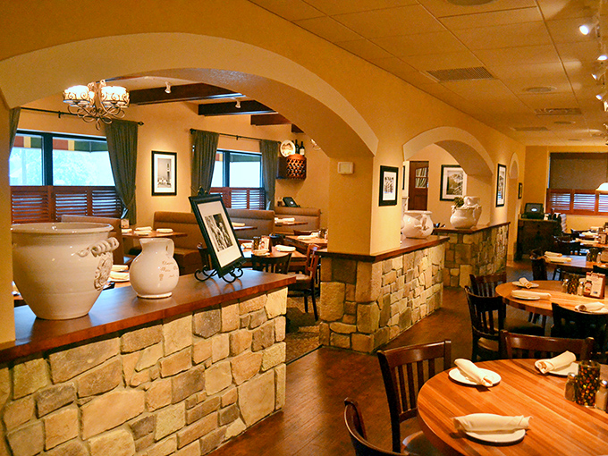 These elegant arches and warm lighting don't just divide dining spaces—they transport you to an Italian villa without the airfare or passport.