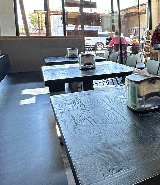 Simple wooden tables with character&mdash;each one a front-row seat to Richmond's burger theater.