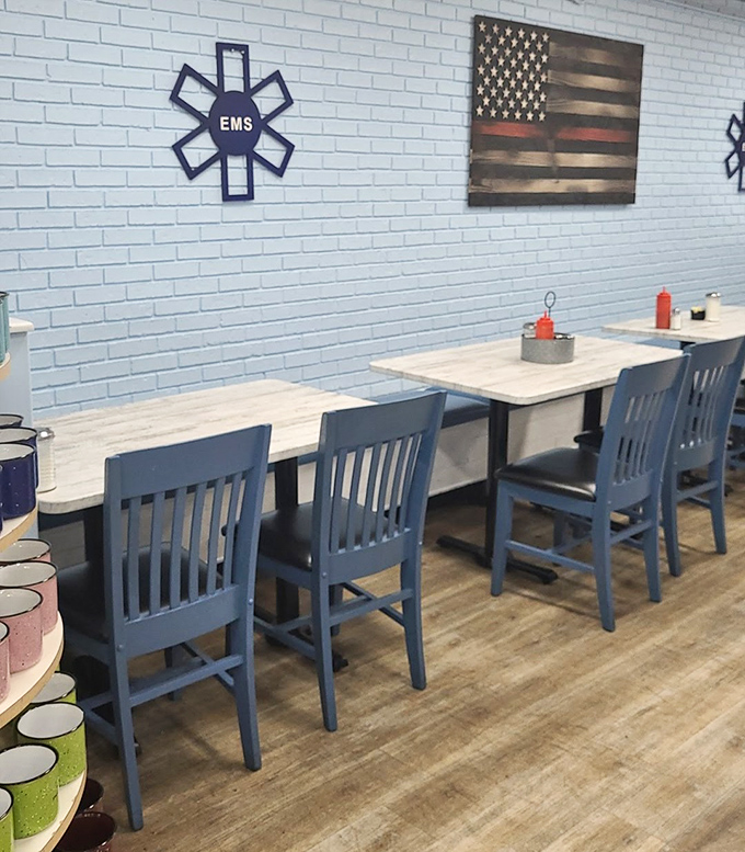 Clean white tables paired with blue chairs against light brick walls create that perfect "come as you are" atmosphere that defines great breakfast joints.