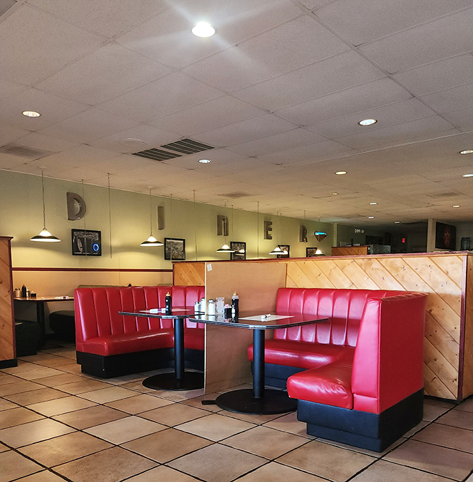 Red vinyl booths that have cradled countless conversations, confessions, and food comas through the years.