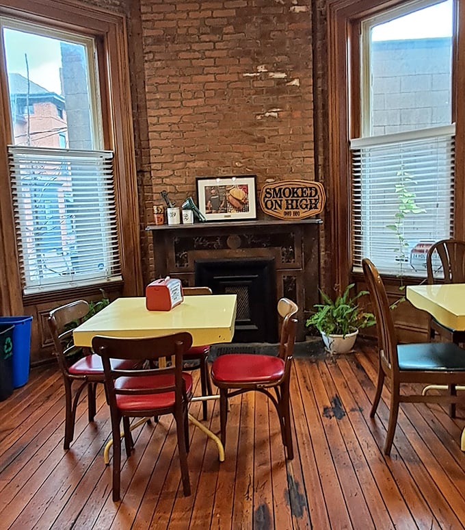 A dining room where history meets hunger. That fireplace has probably witnessed countless "this is the best barbecue I've ever had" declarations.