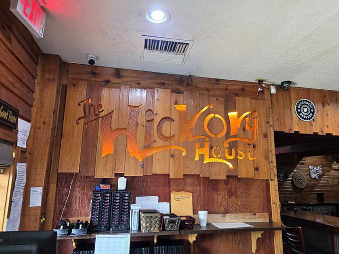 That illuminated wooden sign isn't just decoration&mdash;it's a beacon of hope for hungry travelers. Warm wood tones practically whisper "you've made the right decision."