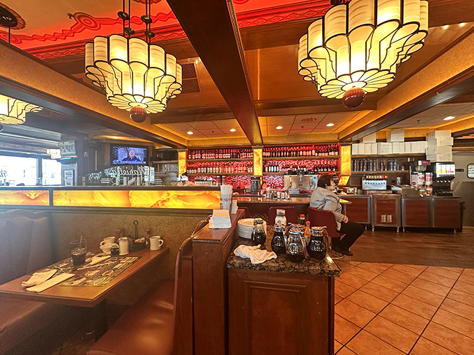 Art Deco chandeliers cast a golden glow across the dining room, creating an atmosphere where calories don't count and diet plans come to die happy deaths.