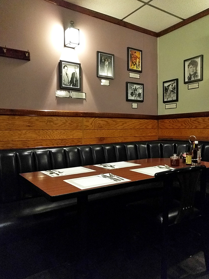 Black leather booths and wood paneling create the perfect backdrop for serious eating. Those framed photos have witnessed countless clean plates.