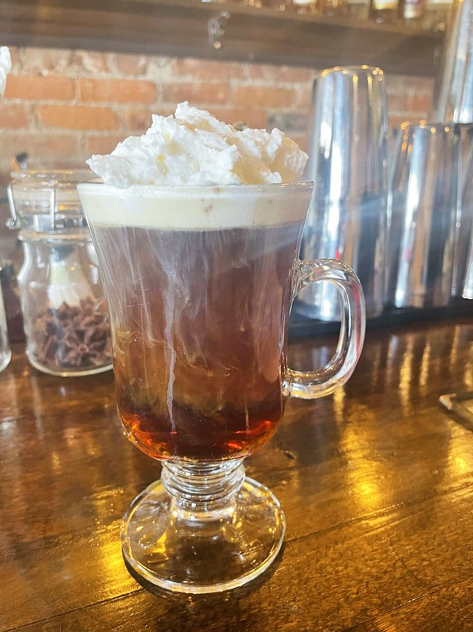 Their iced chai - where cinnamon, cardamom, and caffeine create the perfect morning motivation. Served in a glass that says "take your time."