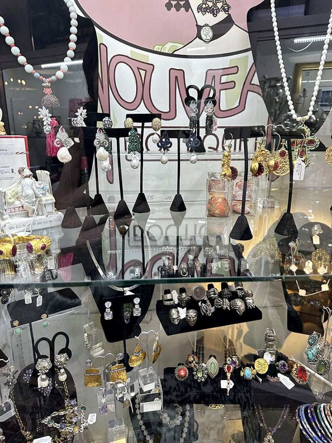 Vintage jewelry sparkles behind glass like captured starlight, each piece waiting for its perfect match.