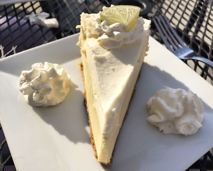 Key lime pie that balances sweet and tart like a high-wire artist. Those dollops of whipped cream aren't decoration&mdash;they're essential supporting players in this citrus symphony.