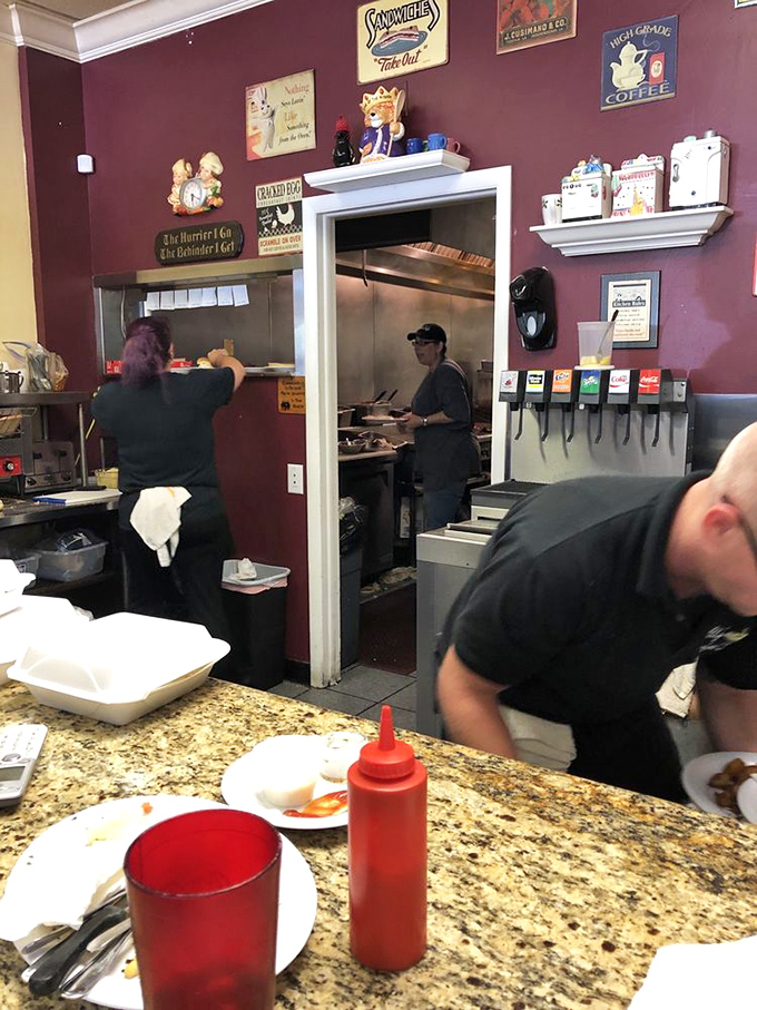 The kitchen pass offers a glimpse of the choreographed chaos where comfort food dreams are born.