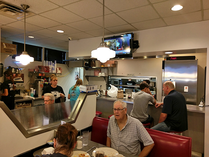 The open kitchen concept lets you witness the beautiful choreography of professional breakfast preparation in real time.