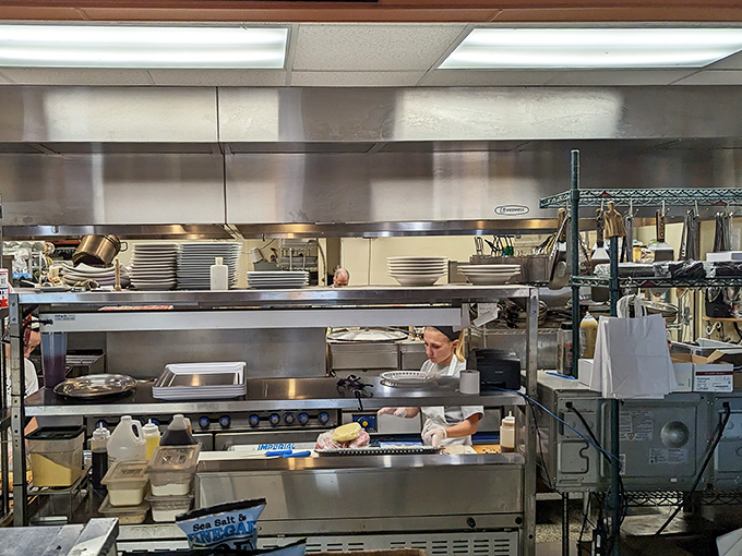 A glimpse into the kitchen where the magic happens. Those hands have probably made more pizza in a day than most of us will in a lifetime.