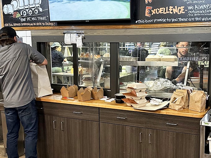 Behind the scenes where BBQ magic happens &ndash; those green smokers are the unsung heroes of your flavor experience.