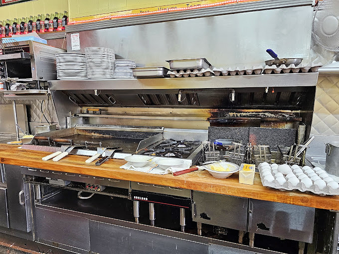 The open kitchen where culinary magic happens right before your very hungry eyes.