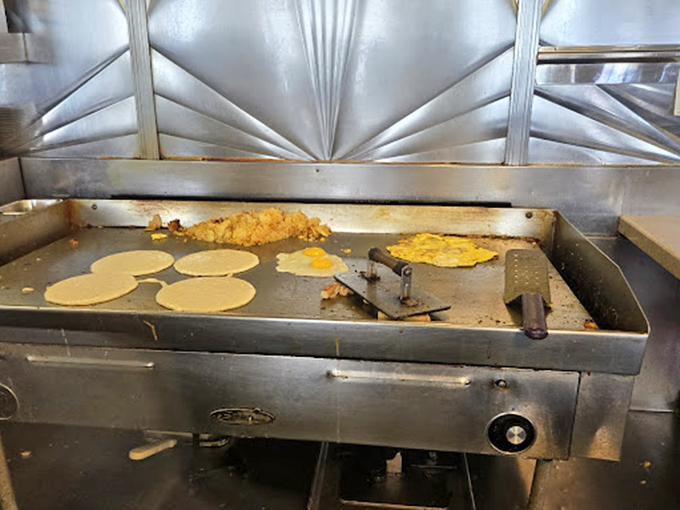 The griddle&mdash;hallowed ground where pancake batter transforms into golden discs of joy. A breakfast ballet performed daily.
