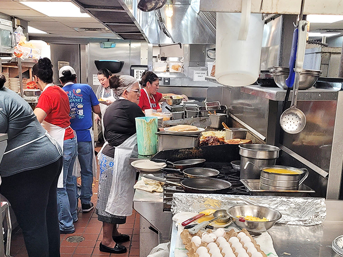 Behind-the-scenes glimpse reveals the organized chaos that produces consistently excellent comfort food daily.