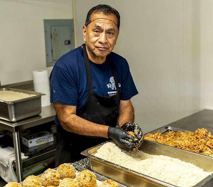 Craftsmanship in action&mdash;skilled hands forming the legendary deviled crabs. This is culinary heritage being preserved one croquette at a time.