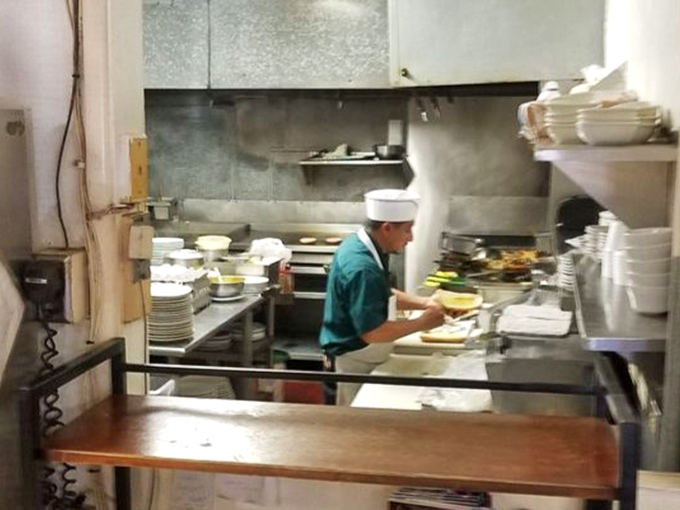 A glimpse into the kitchen where magic happens without pretense. No tweezers or squeeze bottles&mdash;just skilled hands and well-seasoned equipment.