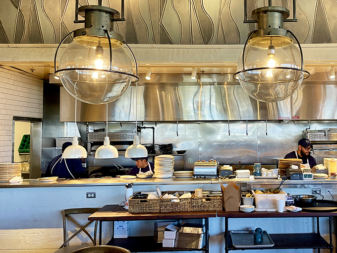 An open kitchen where culinary magic happens under globe lights &ndash; dinner and a show without the ticket price.