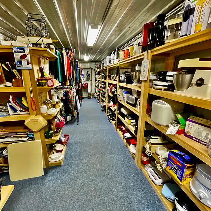 Kitchen gadgets from every era line these shelves. That avocado-green measuring cup has seen more recipes than the Food Network's entire lineup.