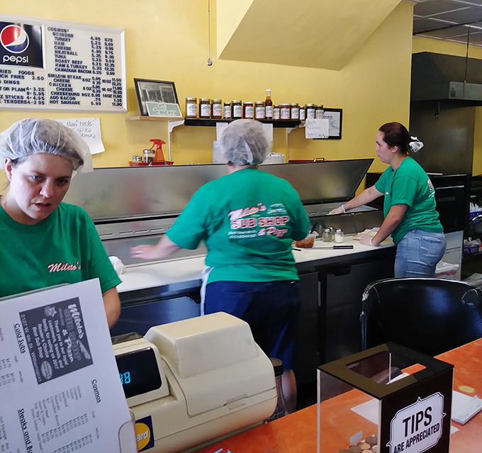 The kitchen crew works with the precision of surgeons and the passion of artists. Great sandwiches don't make themselves.