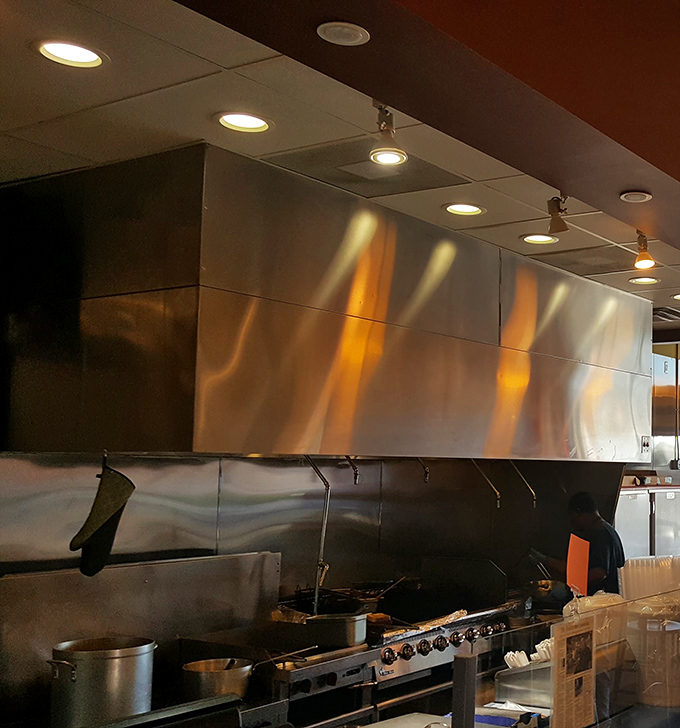 A glimpse into the kitchen reveals the serious hardware behind serious flavor. That's not a stove&mdash;it's a flavor laboratory.