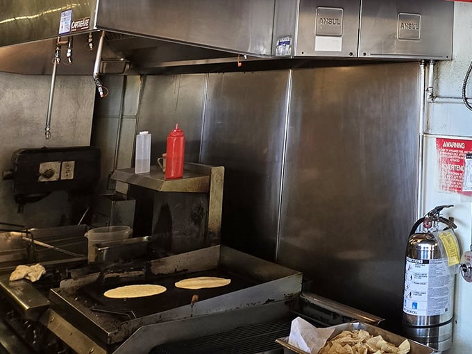 Where the magic happens&mdash;a glimpse into the kitchen's choreography. That flat-top grill has seen more action than a Hollywood stuntman, and the results are equally impressive.