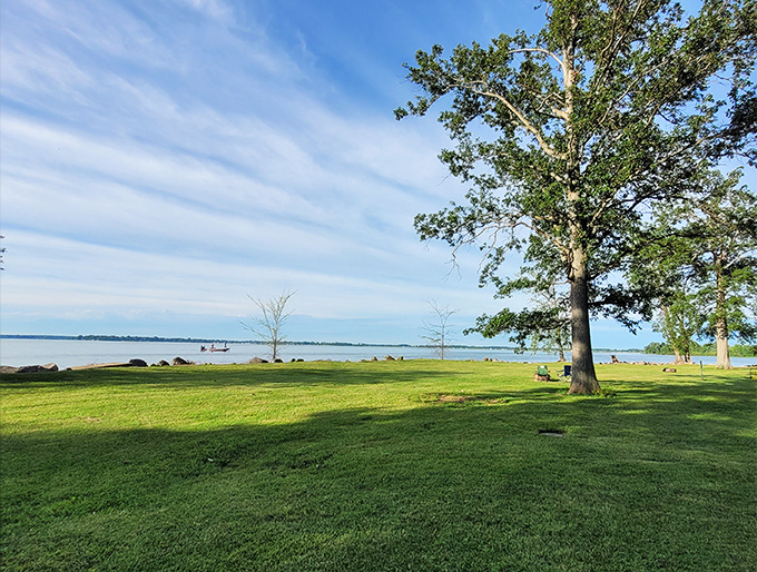 The perfect lakeside lawn&mdash;where doing absolutely nothing becomes an art form worth mastering on a summer afternoon.