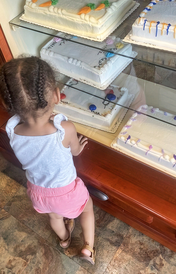 The magic of bakery cases through a child's eyes &ndash; where future sweet memories are being formed one cake at a time.