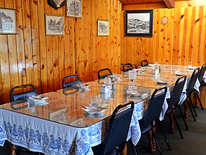 The private dining area awaits your family gathering. Those blue and white tablecloths aren't just decor&mdash;they're a promise of old-world hospitality.