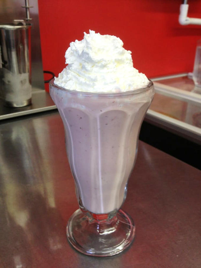 A proper diner milkshake: thick enough to require serious straw strength but worth the effort. Like drinking velvet with a cherry on top.