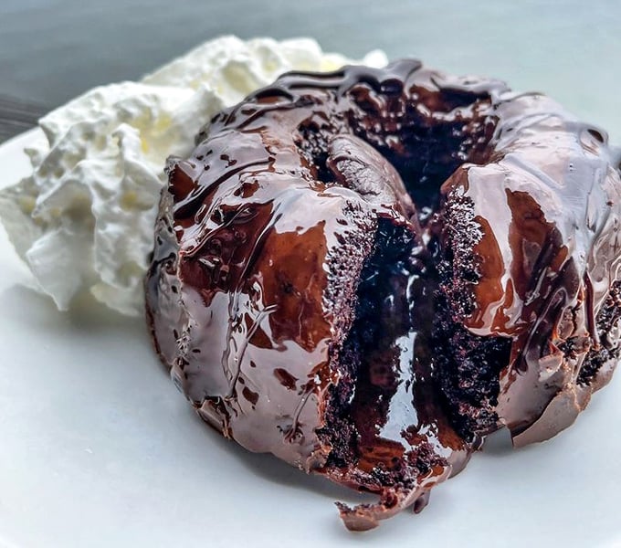A chocolate lava cake that erupts with warm fudgy goodness – proof that even seafood restaurants know we need a sweet finale.