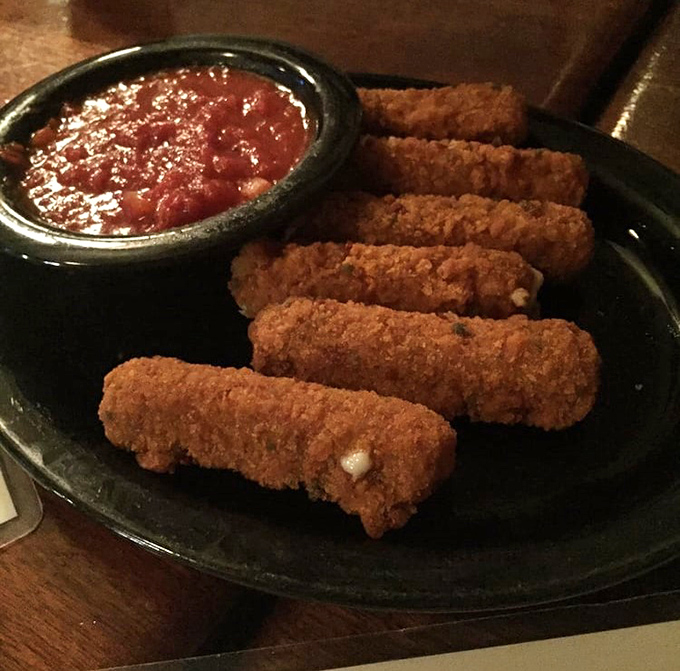 Mozzarella sticks with attitude&mdash;crispy soldiers standing at attention beside a pool of marinara for the perfect cheese pull moment.