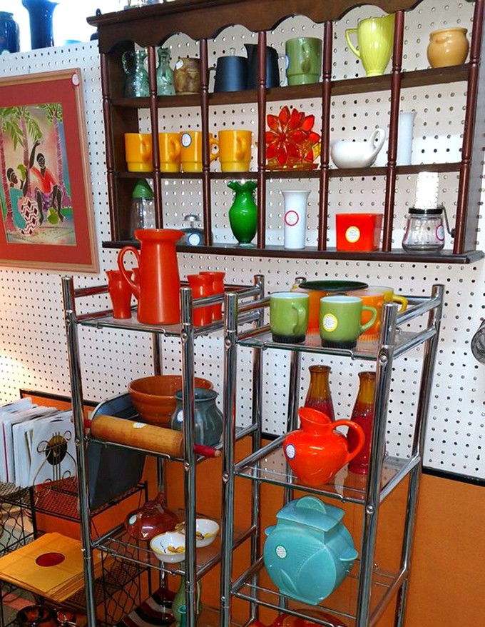 Mid-century modern meets color explosion in this display. Those fiery orange and green pieces once defined "contemporary" for your parents' first apartment.