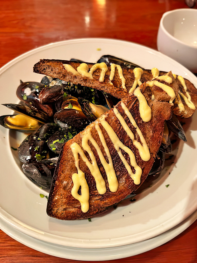 Fresh mussels swimming in aromatic broth that'll have you sopping up every last drop with bread.