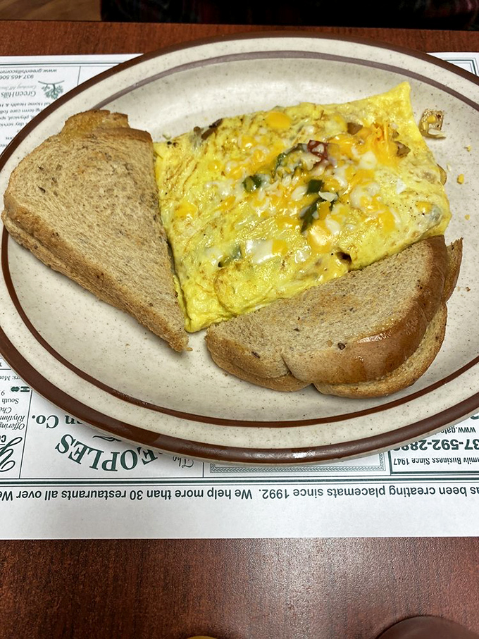 An omelet that knows its purpose in life is to deliver maximum flavor with minimum fuss. Breakfast perfection on a no-nonsense plate.