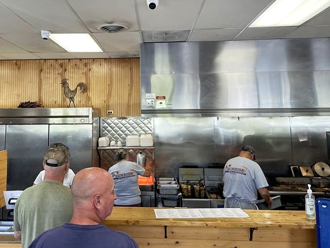 The open kitchen where culinary magic happens without fanfare. No tweezers or squeeze bottles&mdash;just skilled hands and well-seasoned equipment.