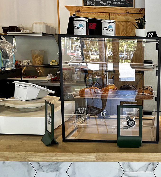 The pastry case &ndash; where morning intentions to "just have coffee" go to die amid tempting croissants and freshly baked treats.