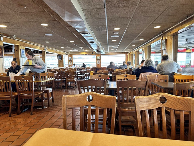 The dining room hums with the satisfied murmurs of patrons who've found their happy place. Wooden chairs have witnessed countless "mmms" over the years.