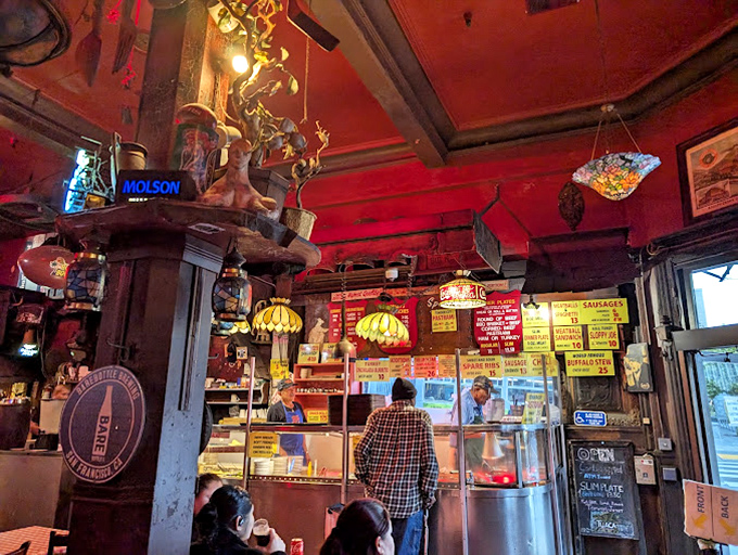 Red walls, wooden stools, and enough memorabilia to start a museum&mdash;Tommy's interior feels like the den of your coolest relative who never throws anything away.