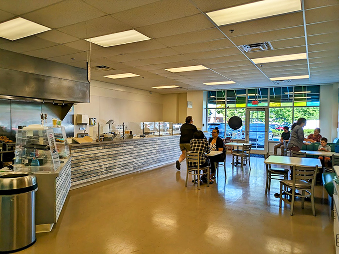 The bright, airy interior invites you to linger, as if to say, "Sure, you came for donuts, but stay for the atmosphere."