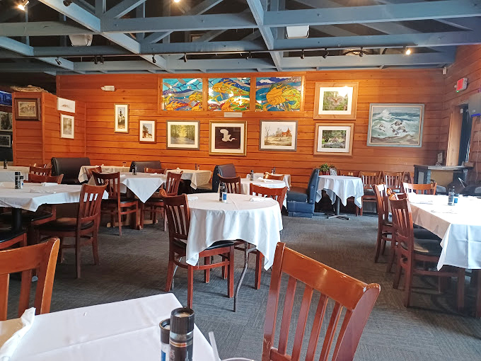 White tablecloths and wooden chairs create an unpretentious elegance. The kind of place where memories are made between bites.