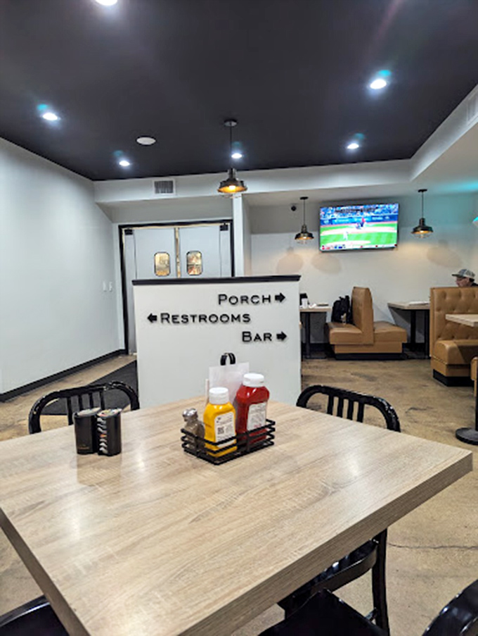 Modern touches like TVs and directional signage blend seamlessly with the restaurant's comfortable, casual atmosphere.