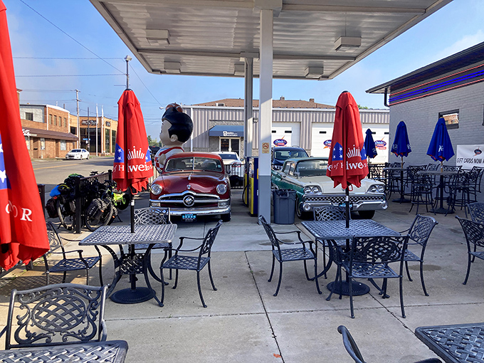Outdoor seating under the original gas station canopy &ndash; where vintage cars and comfort food create the perfect American tableau.
