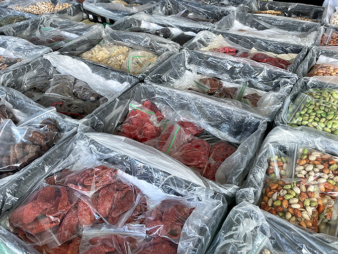Dried fruits, nuts, and spices in a mesmerizing grid of culinary possibilities. Like an analog version of online shopping, but with smells and samples!