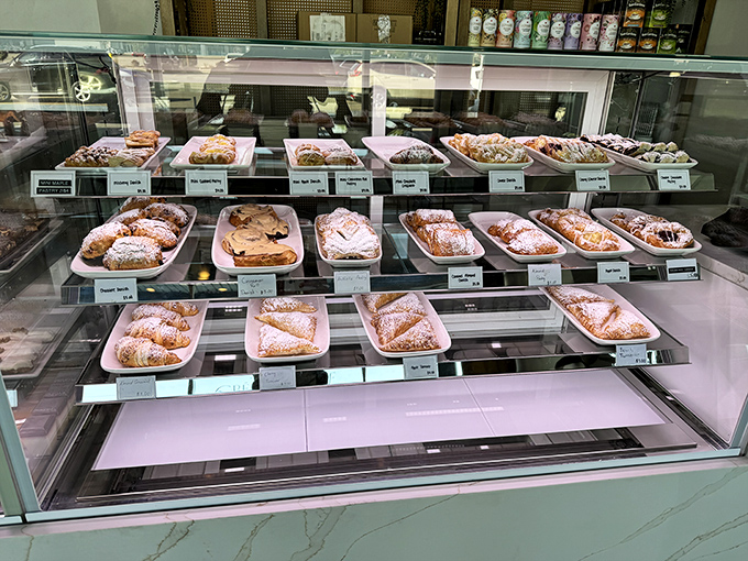 A glass case of temptation that makes willpower utterly useless. Each pastry sits like a sugary contestant in the world's most delicious beauty pageant.